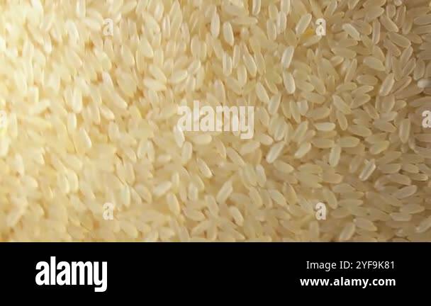 Dry Uncooked Parboiled Rice Background Rotating Clockwise - Top View ...
