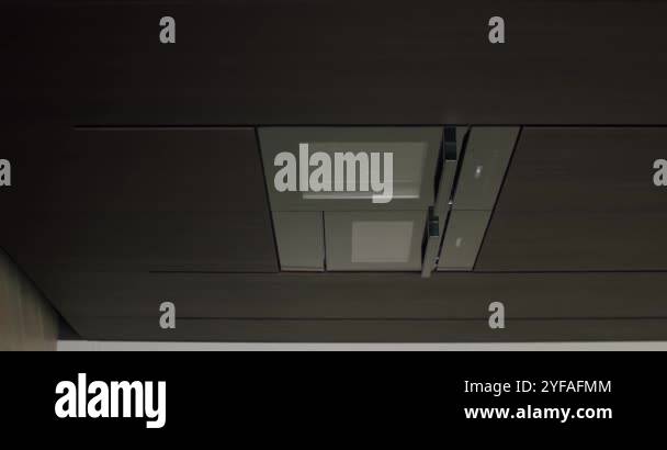 A ceiling-mounted modern kitchen exhaust system with sleek design and ...