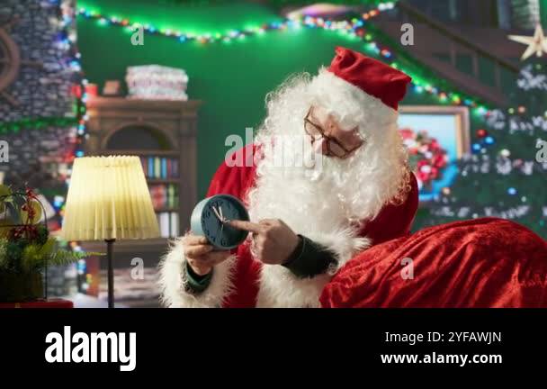 Santa Claus showcasing the Christmas eve with a wall clock in his log ...