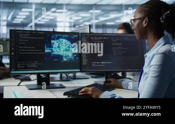 Woman programming in AI data center housing advanced equipment used for ...