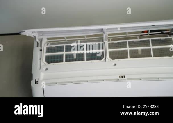 Close-up of an air conditioner in an apartment showing both clean and ...
