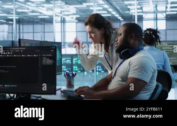 Manager showing admin how to finish tasks in data center providing ...