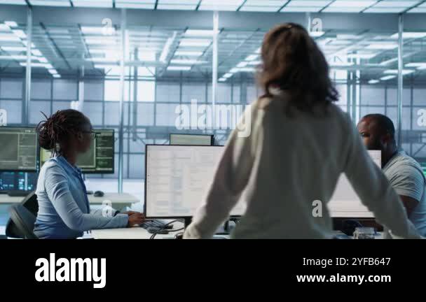 Admin arriving in server hub, sitting at computer desk, checking ...