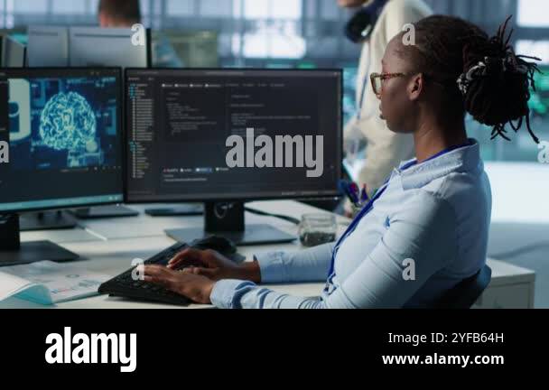 Woman leaving desk after finishing programming tasks in AI data center used for machine learning ...