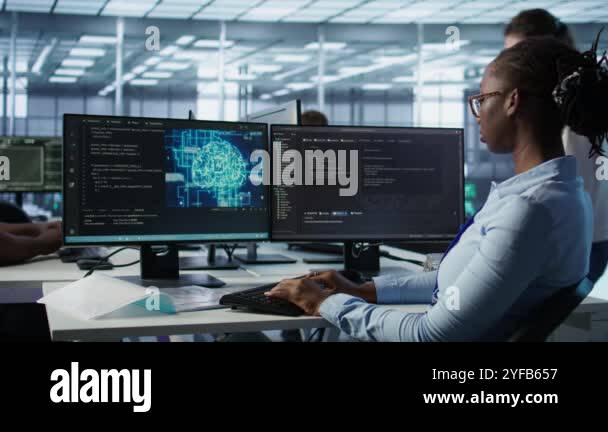 Woman leaving desk after finishing programming tasks in AI data center used for machine learning ...