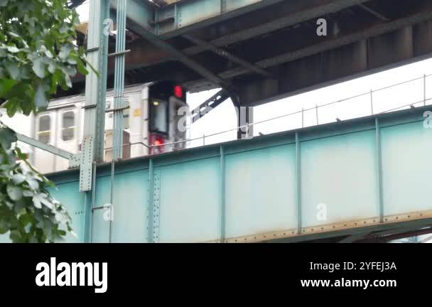 New York elevated subway, metropolitan bridge, metro track above street ...