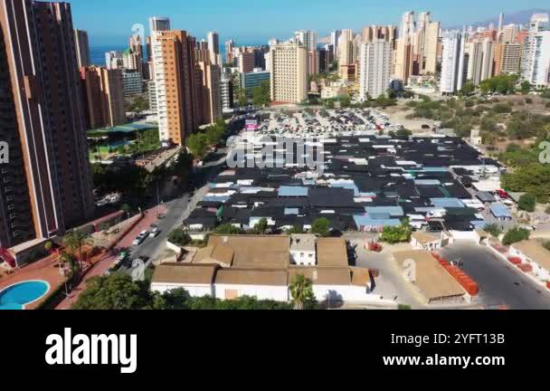 Aerial drone footage of the beautiful city of Benidorm in Spain in the ...