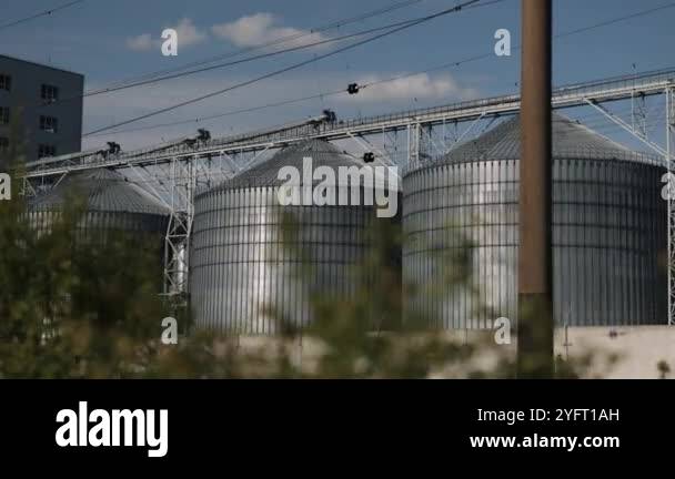 Silo metal, Industrial complex, Blue backdrop. Metallic silos for ...