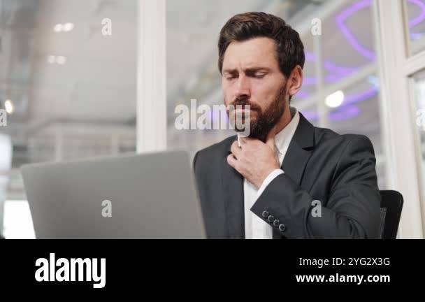 Ill businessman experiences a sore throat at the office. Hes dressed in ...
