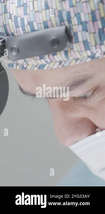 Close-up of surgeon performing operation. Action. Attentive and focused ...