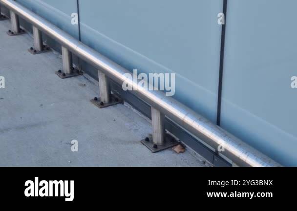 around the facade and columns of the underground garage is a metal ...