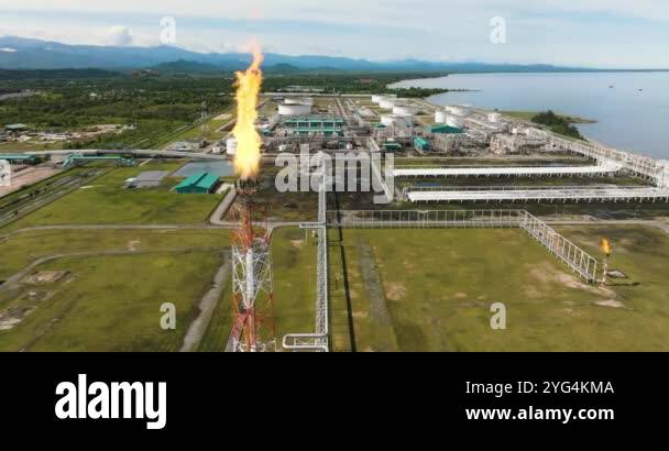 Aerial view of fire on flare stack at refinery oil and gas central ...