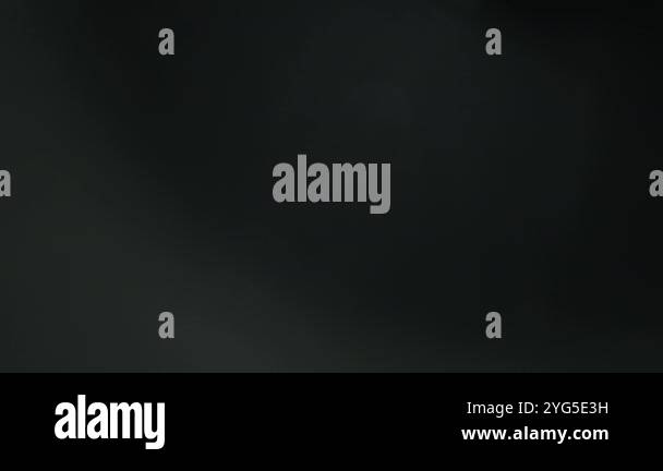 Lens flare overlay fading out to black background in slow motion Stock ...