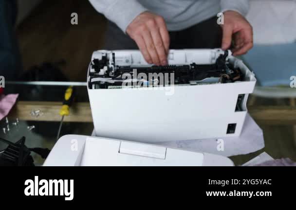 Printer repairman inspecting printer interior. Concept of professional ...