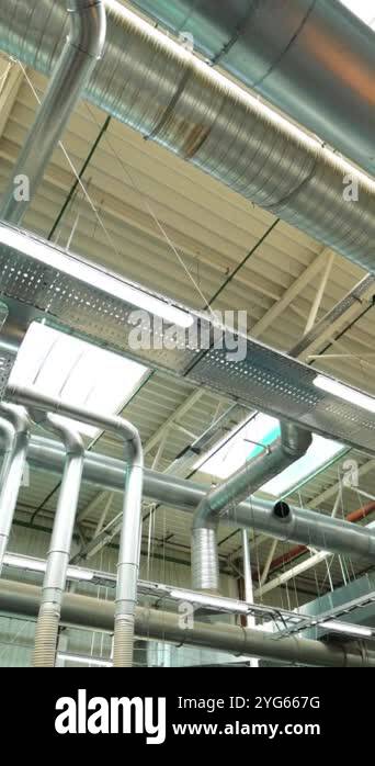 Industrial factory ceiling with ventilation system and lights ...