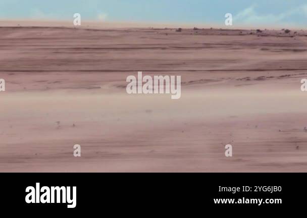 Distant horizon blurred by wind-blown sands in a desert setting. smooth ...