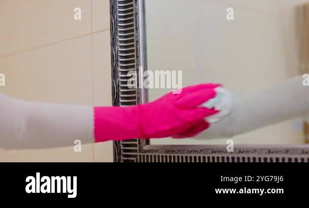 A closeup of a gloved hand cleaning a surface, showcasing effective ...