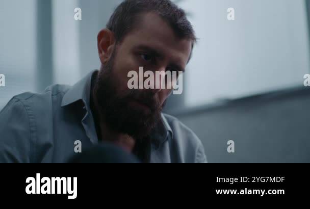 Close up of frustrated office worker sitting on the floor, breathing ...
