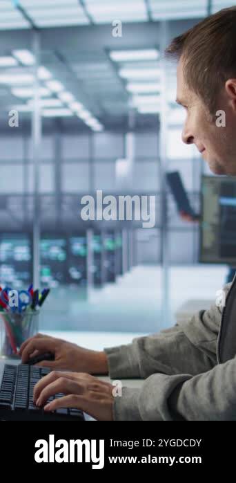 System Administrator In Server Room Doing System Analysis Coding