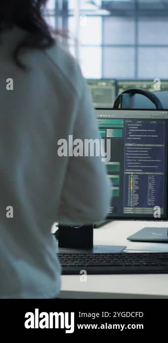 IT employee programming in AI server farm housing advanced equipment ...