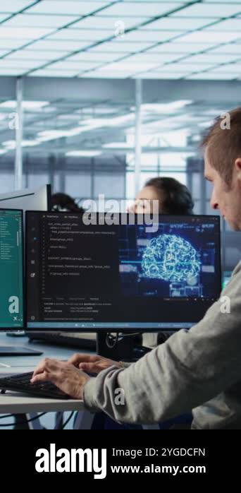 Engineer in server hub making AI software turning text prompt into photos. Technician in data ...