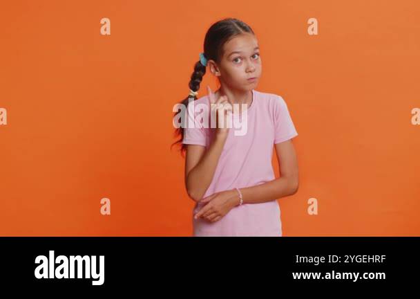Young preteen child girl kid shakes finger and saying no, be careful ...