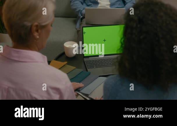 Back view slowmo shot of mature Caucasian female fashion designer and ...