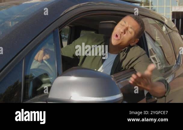 Aggressive nervous black male driver stuck in traffic jam, shouting at ...