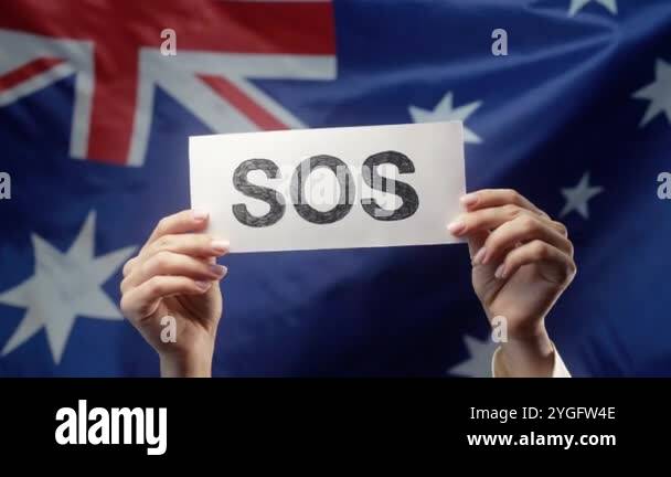 Female Hands With Sos, Alarm, Emergency Card On Australian Flag ...