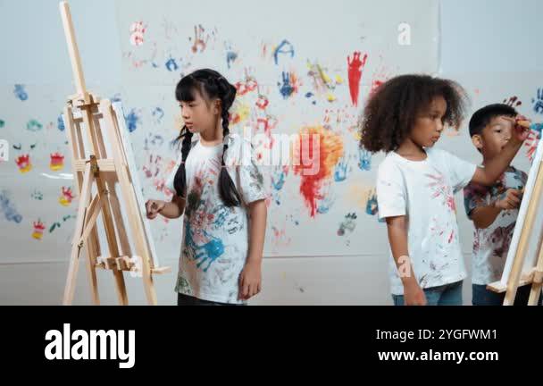 Diverse student painted or draw canvas at stained wall in art lesson ...