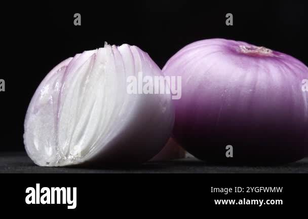 Macrography, the vibrant essence of fresh sliced red onion against a ...