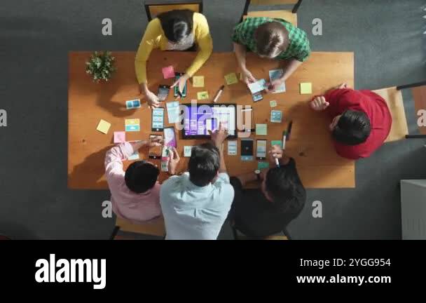 Programmer sharing Ux Ui design for mobile phone interface idea with software developer at ...