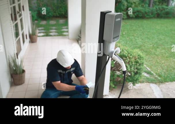 Qualified technician install home EV charging station, providing maintenance service for ...
