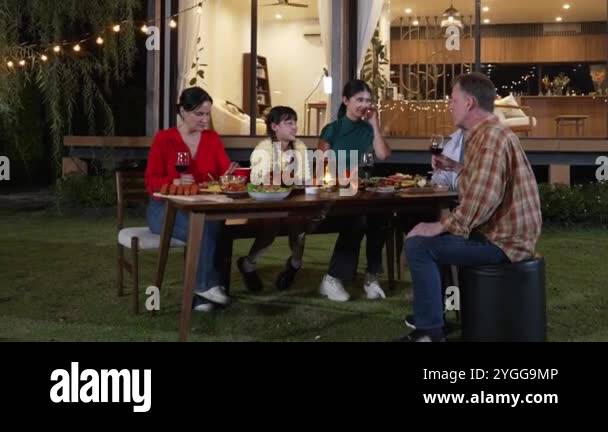 Family together for holiday celebration in garden. Family member gather ...