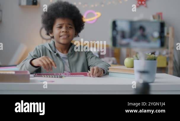 Creative African American child recording video for online vlog ...