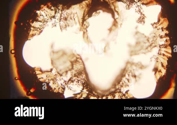 A captivating shot of melting 8mm film, showcasing dynamic bubbling and ...