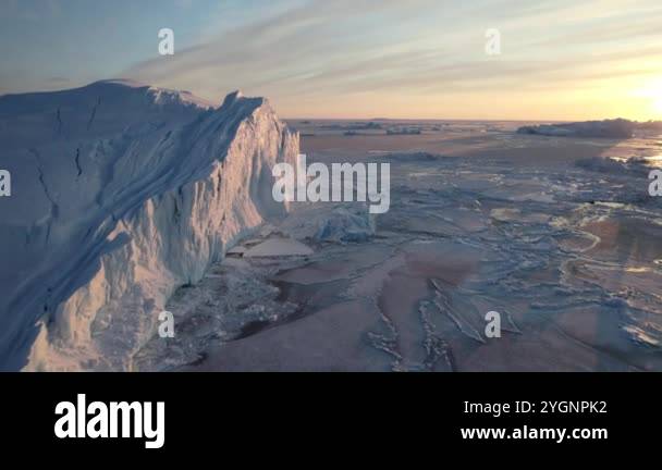 An aerial view reveals a sprawling landscape of icebergs and floating ...
