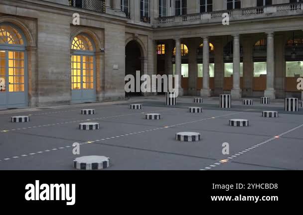 Striped columns in the courtyard of Palais Royal, Paris, illuminated at ...
