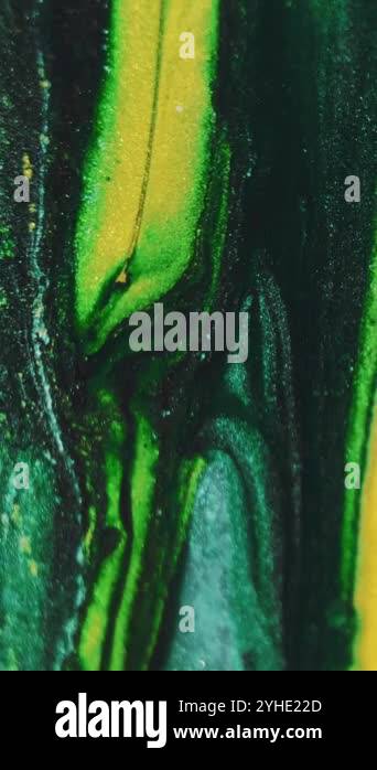 Vertical video. Paint drip. Glitter fluid spill. Defocused bright green ...