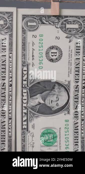 A close-up of a one-dollar bill shows George Washingtons portrait ...