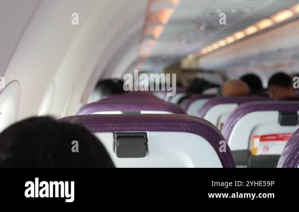 inside interior of airplane aircraft cabin full of passenger on every ...