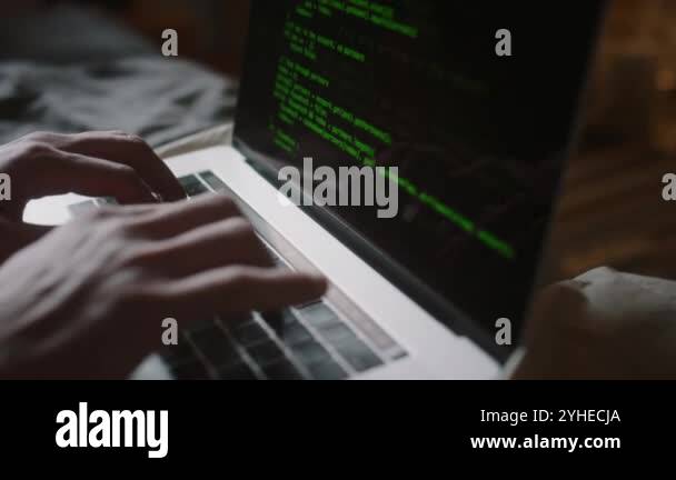 Close-up view of hands of unrecognisable male programmer coding on ...
