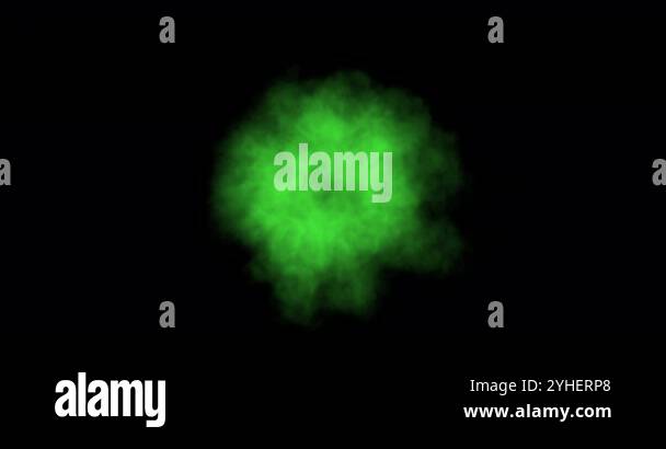 green smoke explosion slowly floating through space against black ...