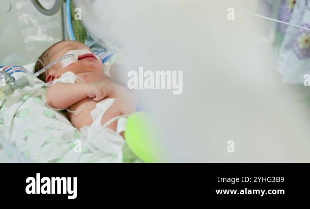 A newborn baby receiving crucial and lifesaving care in a neonatal unit ...