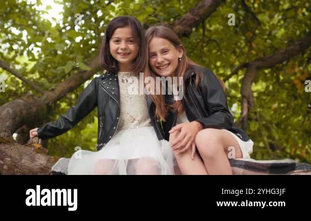 Two sisters hugging tree Stock Videos & Footage - HD and 4K Video Clips ...