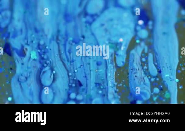 Acrylic liquid drip. Glitter paint spill. Defocused blue color shiny ...