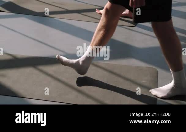 Yoga group. Aerobic workout. Active people stepping barefoot on sport ...