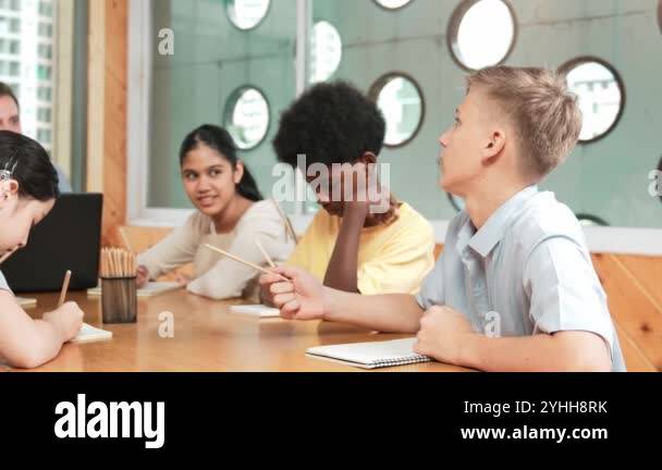 Smart boy listening teacher explain while lecturing and think about ...