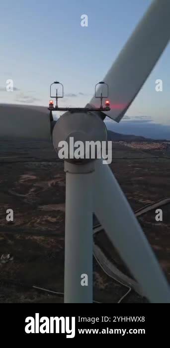 Video of a wind turbine, captured at dusk, highlighting the sustainable ...