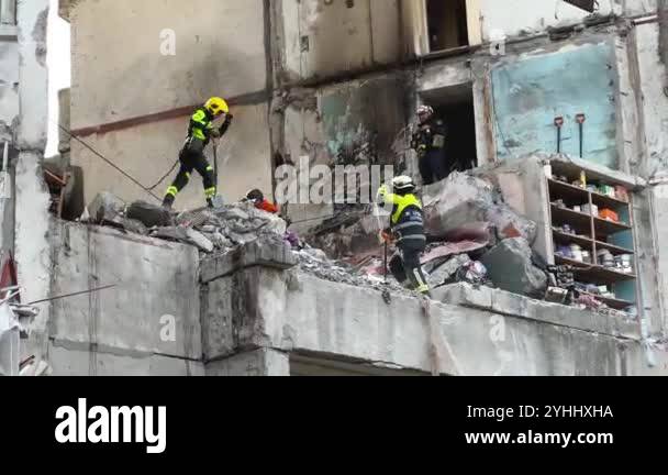 Kharkiv, Ukraine - October, 18, 2024: Rescuers are dismantling the ...